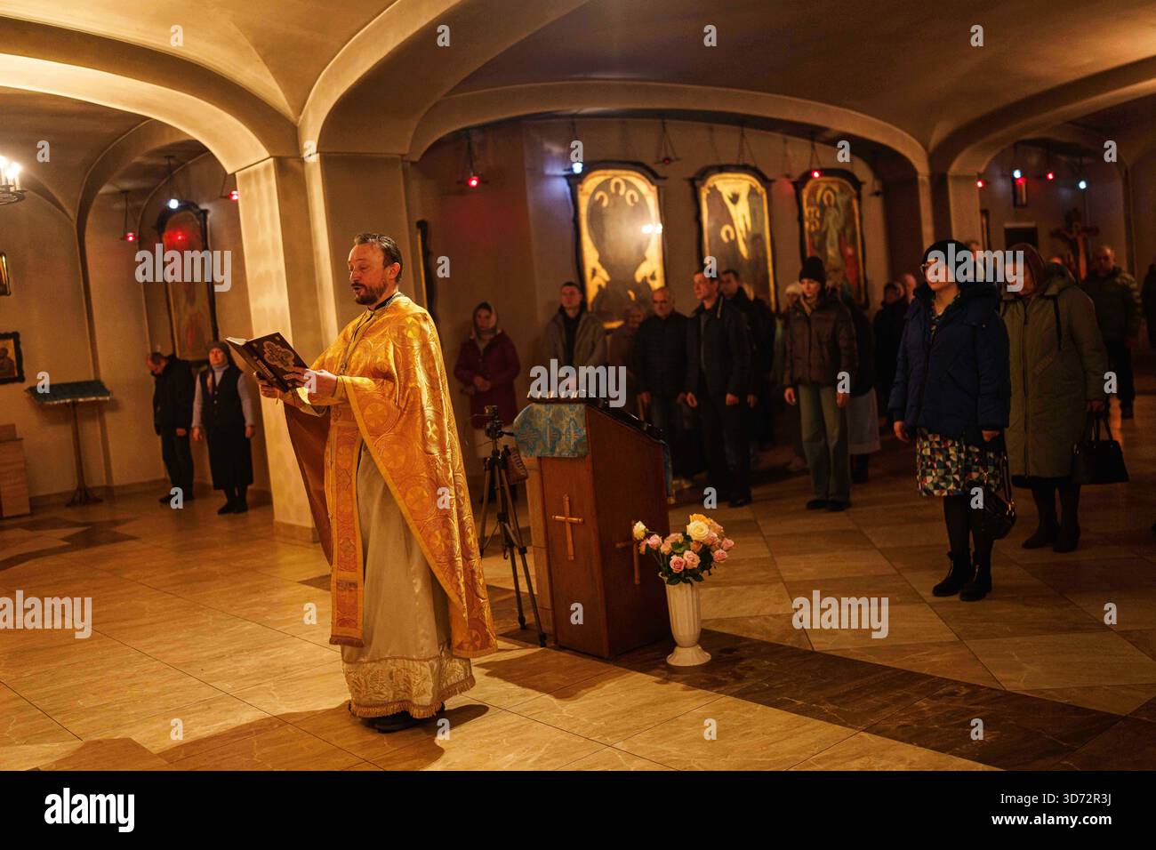A priest Andrii Holovin conducts the service at the Holy Apostle Andrew ...