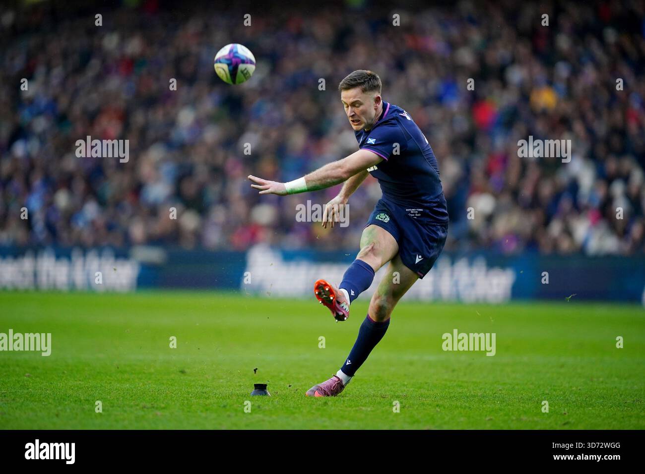 Scotland's Fergus Burke kicks a conversion following his sides second ...