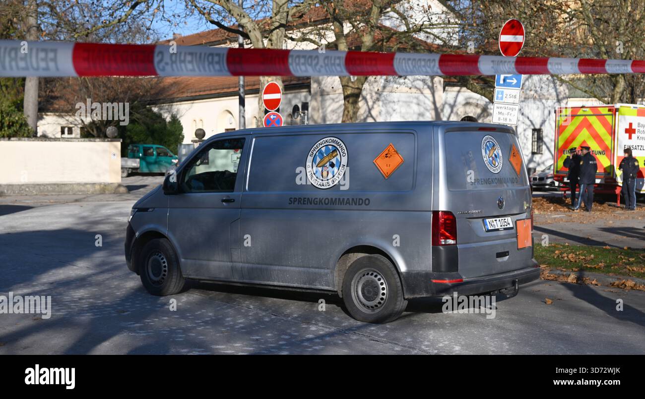 23 November 2025, Bavaria, Munich: The defused bomb is taken away in a ...