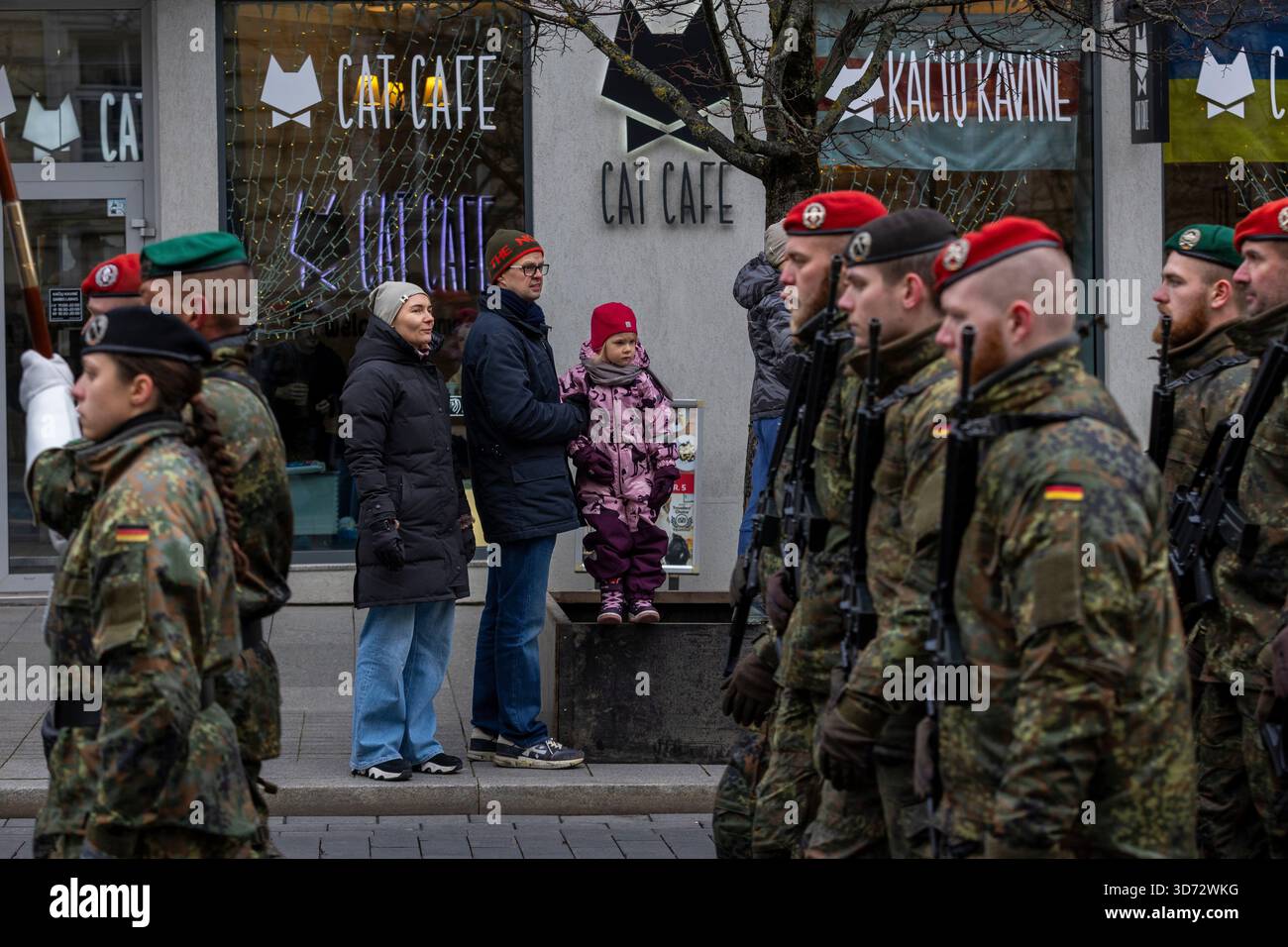People watch the German soldiers march during a military parade ...