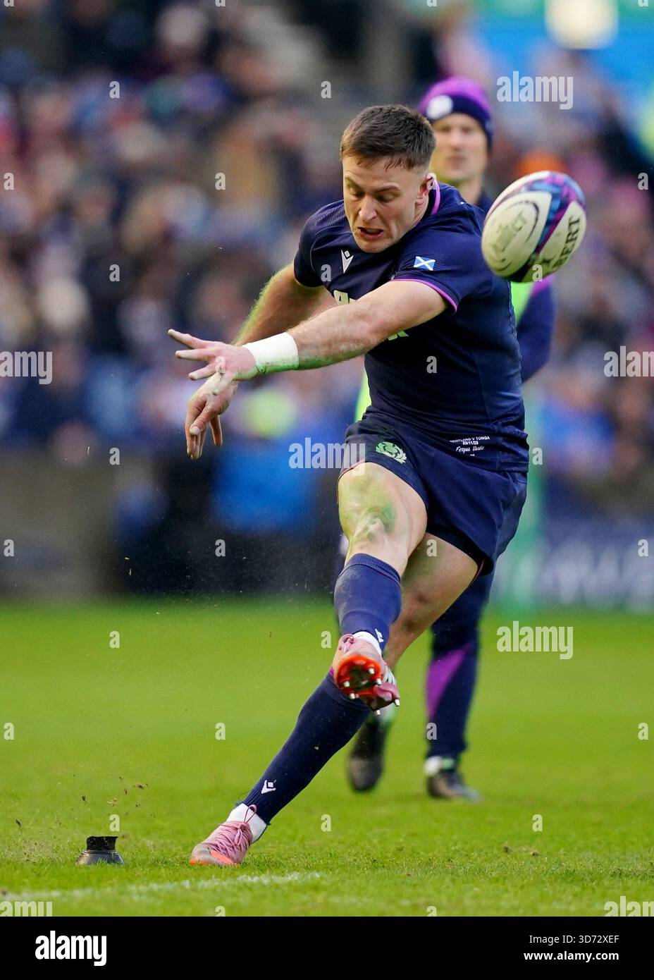Scotland's Fergus Burke kicks a conversion following his sides first ...