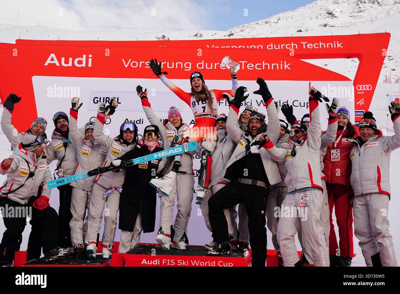 Switzerland's Camille Rast, center, celebrates with the team after ...