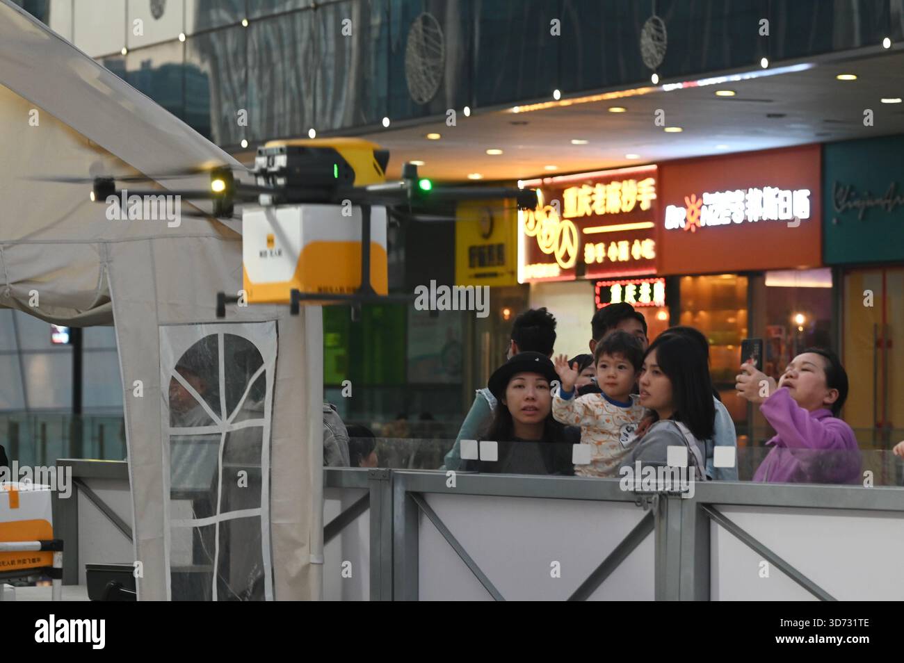 A general view showing the people watching the China brand meituan Food ...