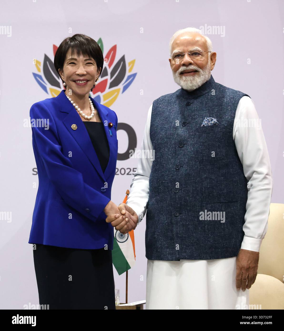 Japanese Prime Minister Sanae Takaichi shakes hands with India Prime ...