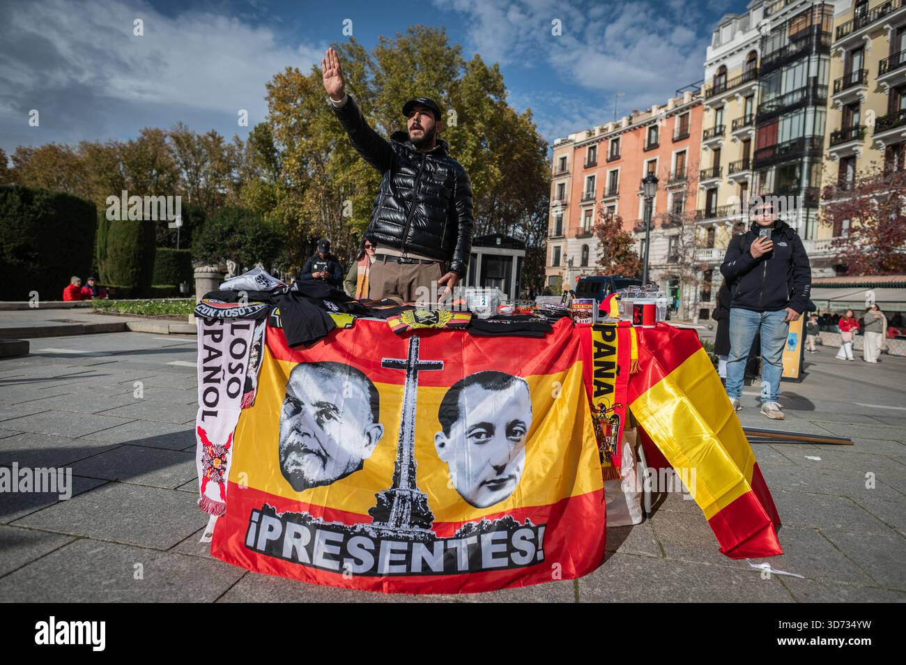 A man makes a fascist salute with the images of dictator Francisco ...