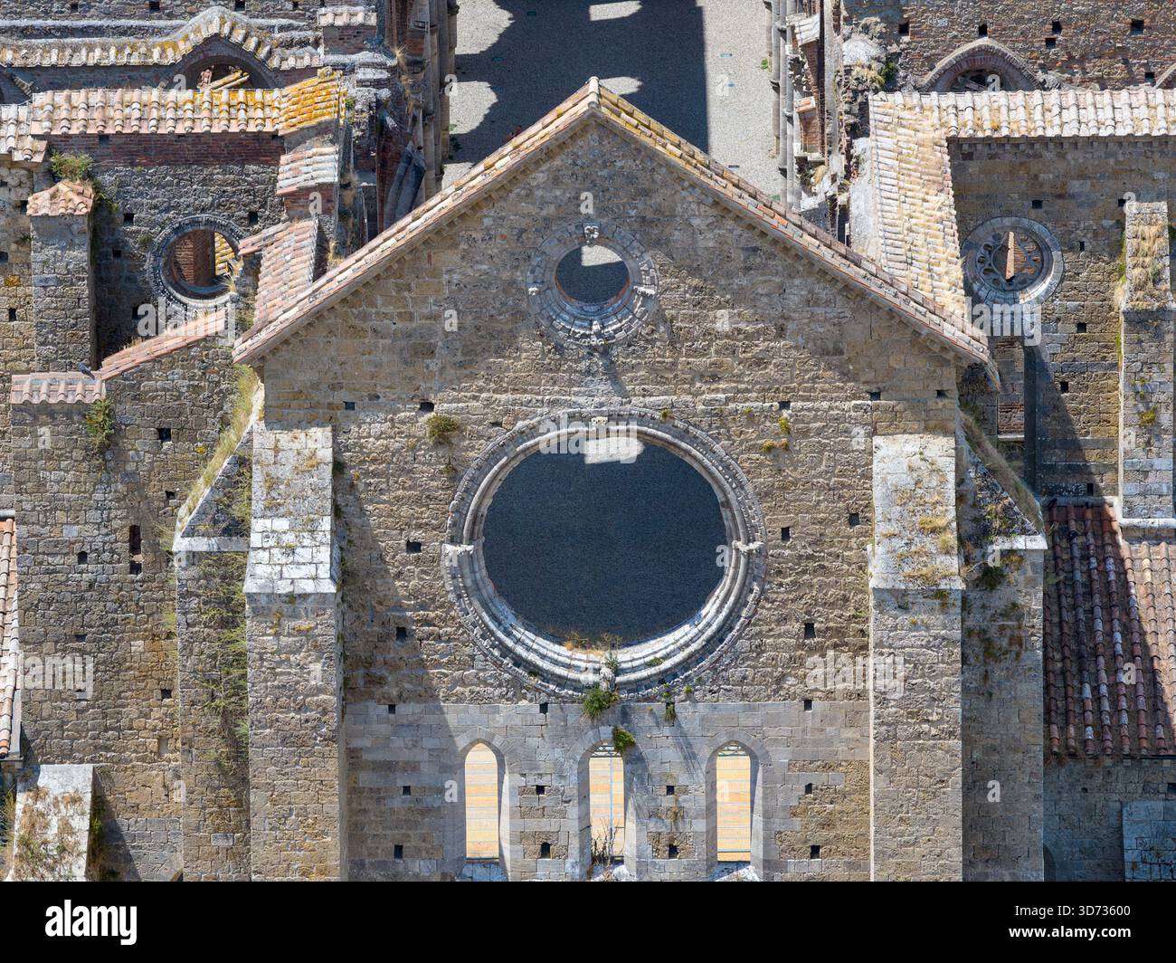 Stone facade and rose window opening of ruined Cistercian Abbey of San ...