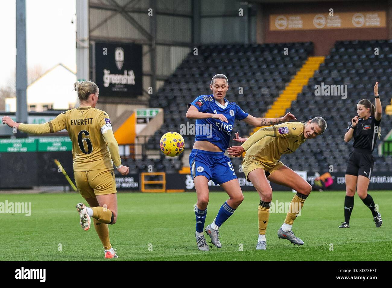 6, Amy Everett of Crystal Palace prepares to clear the ball as 5, Emily ...