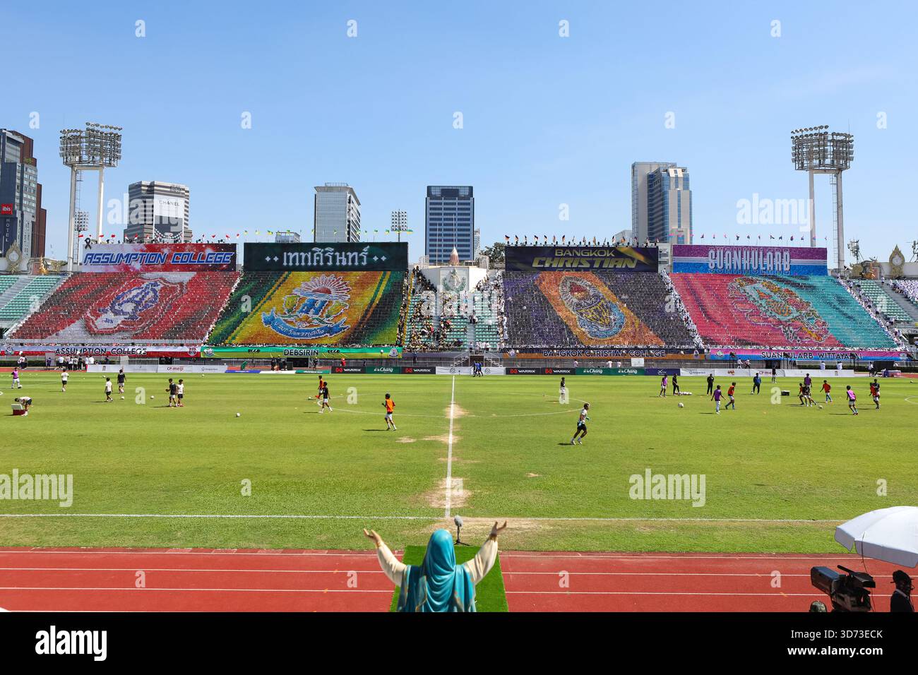 The students teamed up to perform card stunts on grandstand at the 31st ...