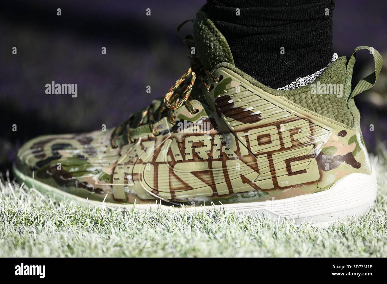 Baltimore Ravens center Tyler Linderbaum wears cleats before an NFL ...