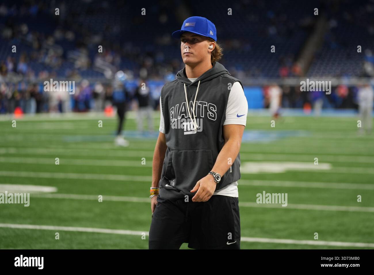 Injured New York Giants quarterback Jaxson Dart walks down the field ...