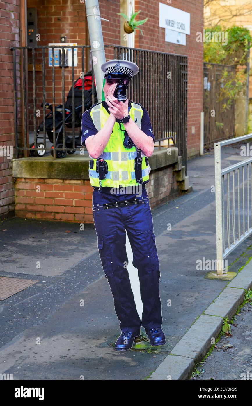 Cardboard cutout of a Police Officer holding a speed camera beside a ...