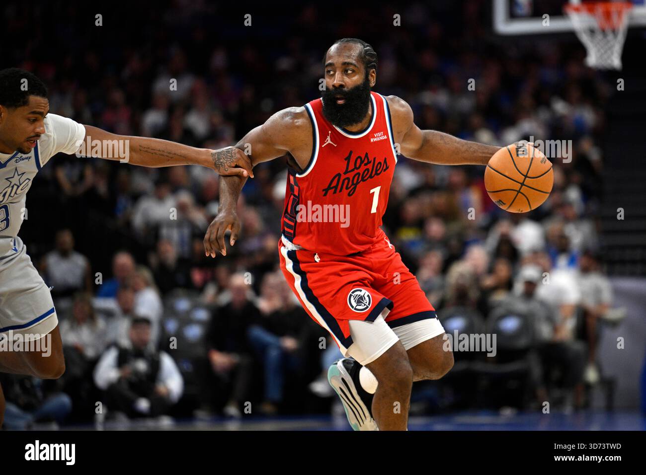 Los Angeles Clippers guard James Harden (1) is defended by Orlando ...