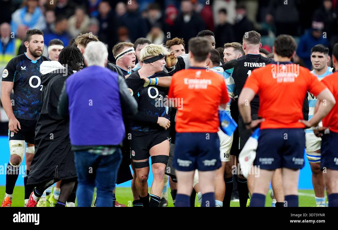 England's Henry Pollock (centre) is restrained by his team mates at the ...