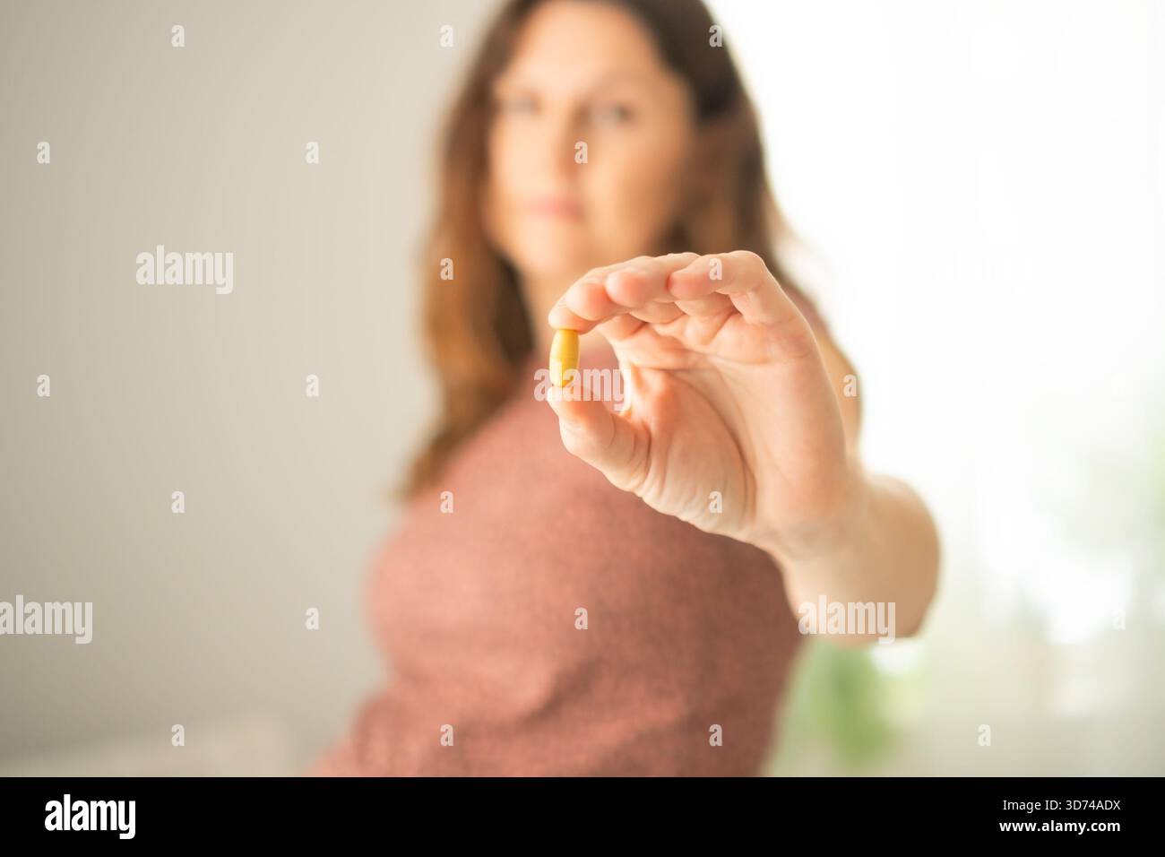 Pregnant female carefully examining hi-res stock photography and images ...
