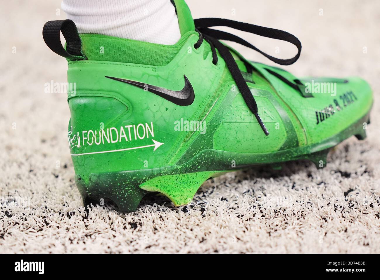 The cleats of Dallas Cowboys long snapper Trent Sieg (44) are shown ...