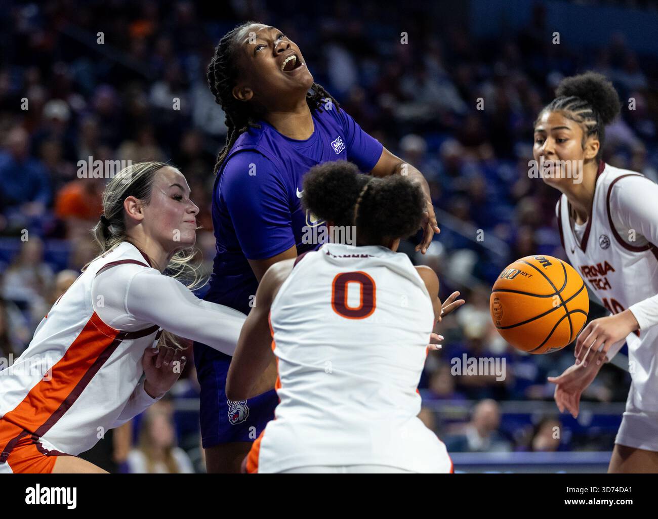 Virginia Tech guard Carleigh Wenzel (1) pops the ball loose from James ...