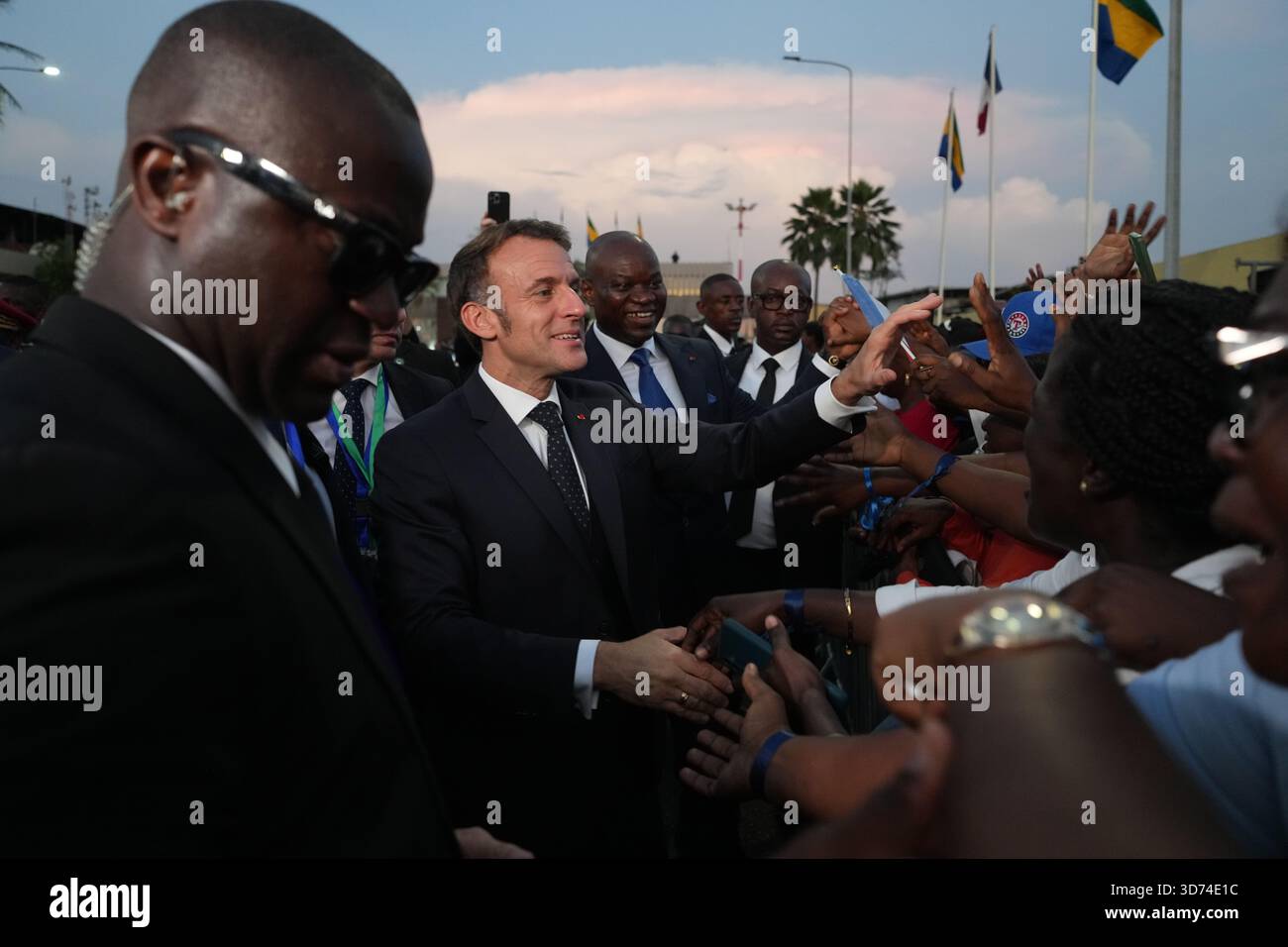 French President Emmanuel Macron, center, and Gabon's President Brice ...