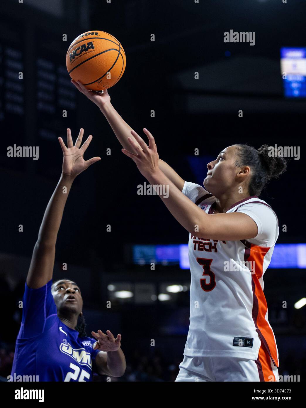 Virginia Tech guard Mackenzie Nelson (3) takes a shot over James ...