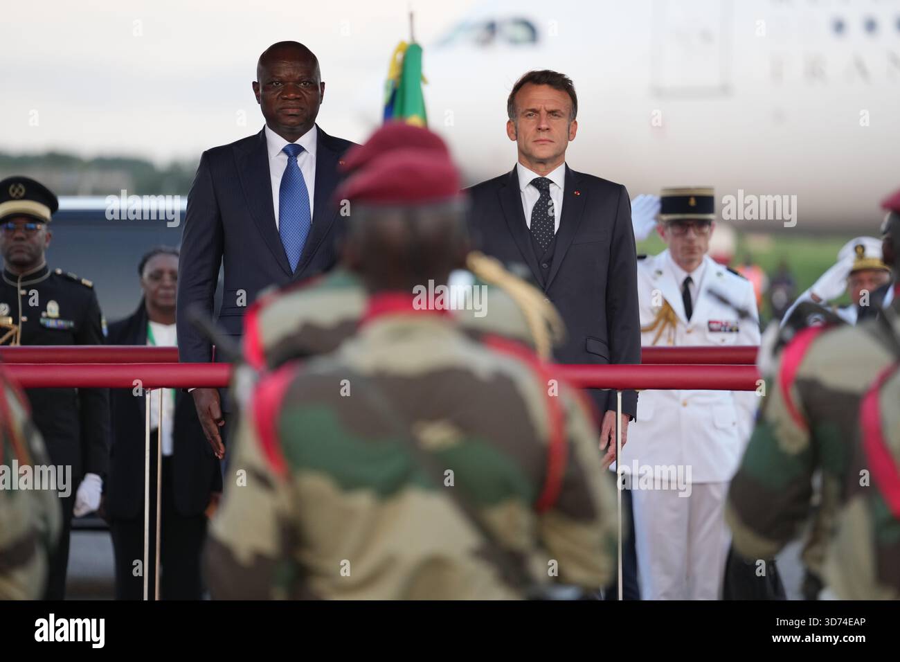 French President Emmanuel Macron, right, is greeted by Gabon's ...