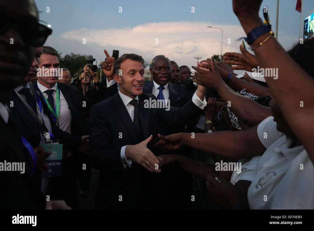 French President Emmanuel Macron, center, and Gabon's President Brice ...
