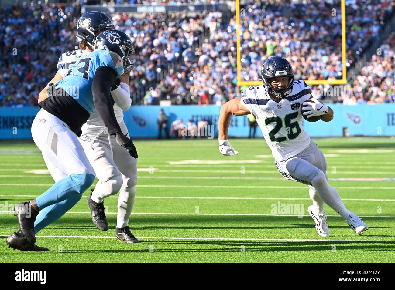 Seattle Seahawks running back Zach Charbonnet (26) runs five yards for ...