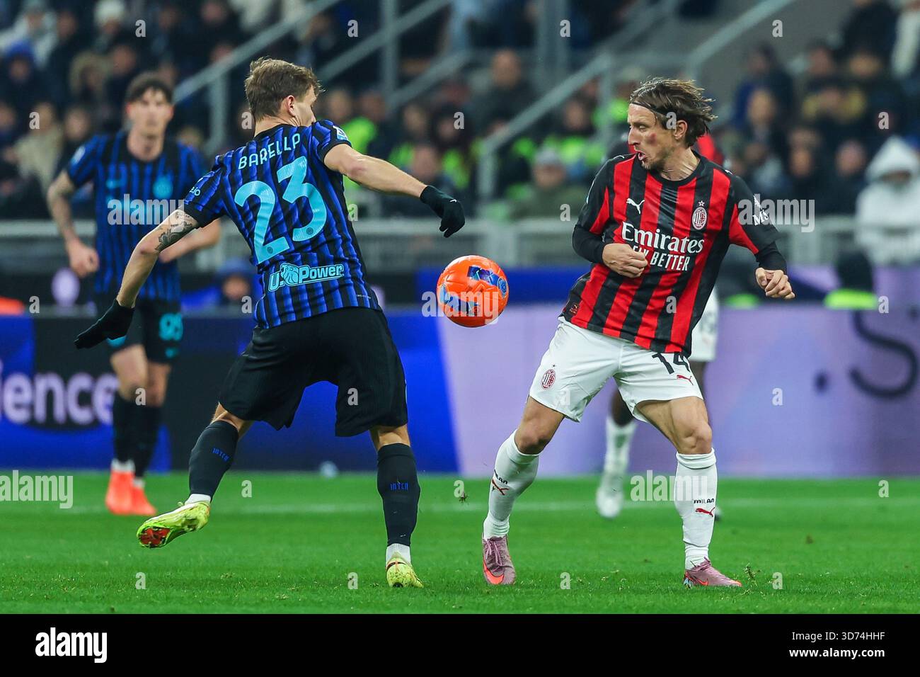 Luka Modric of AC Milan competes for the ball with Nicolo Barella of FC ...