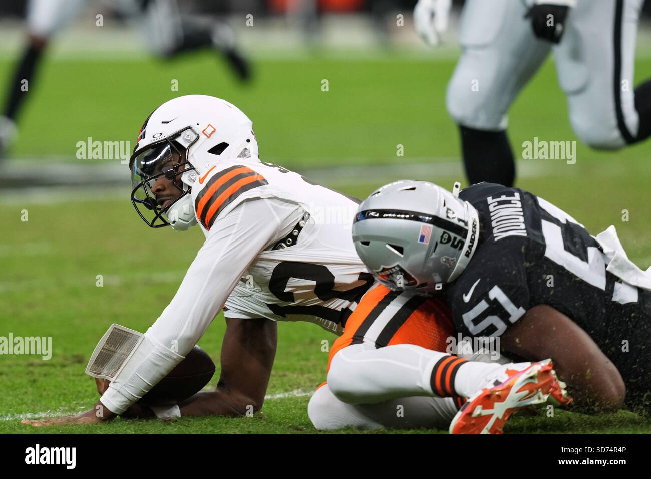 Las Vegas Raiders defensive end Malcolm Koonce (51) sacks Cleveland ...