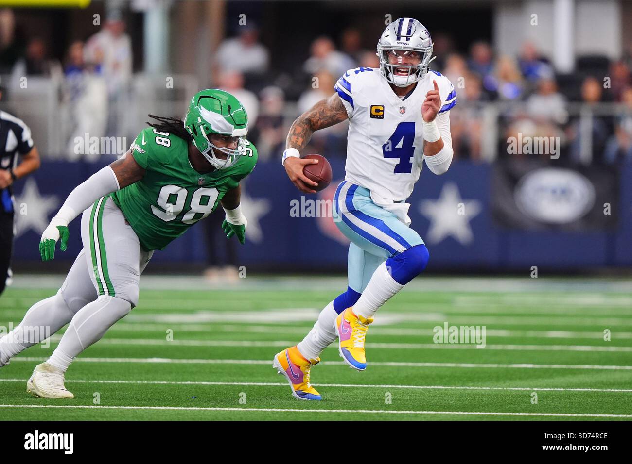 Dallas Cowboys quarterback Dak Prescott (4) is chased by Philadelphia ...