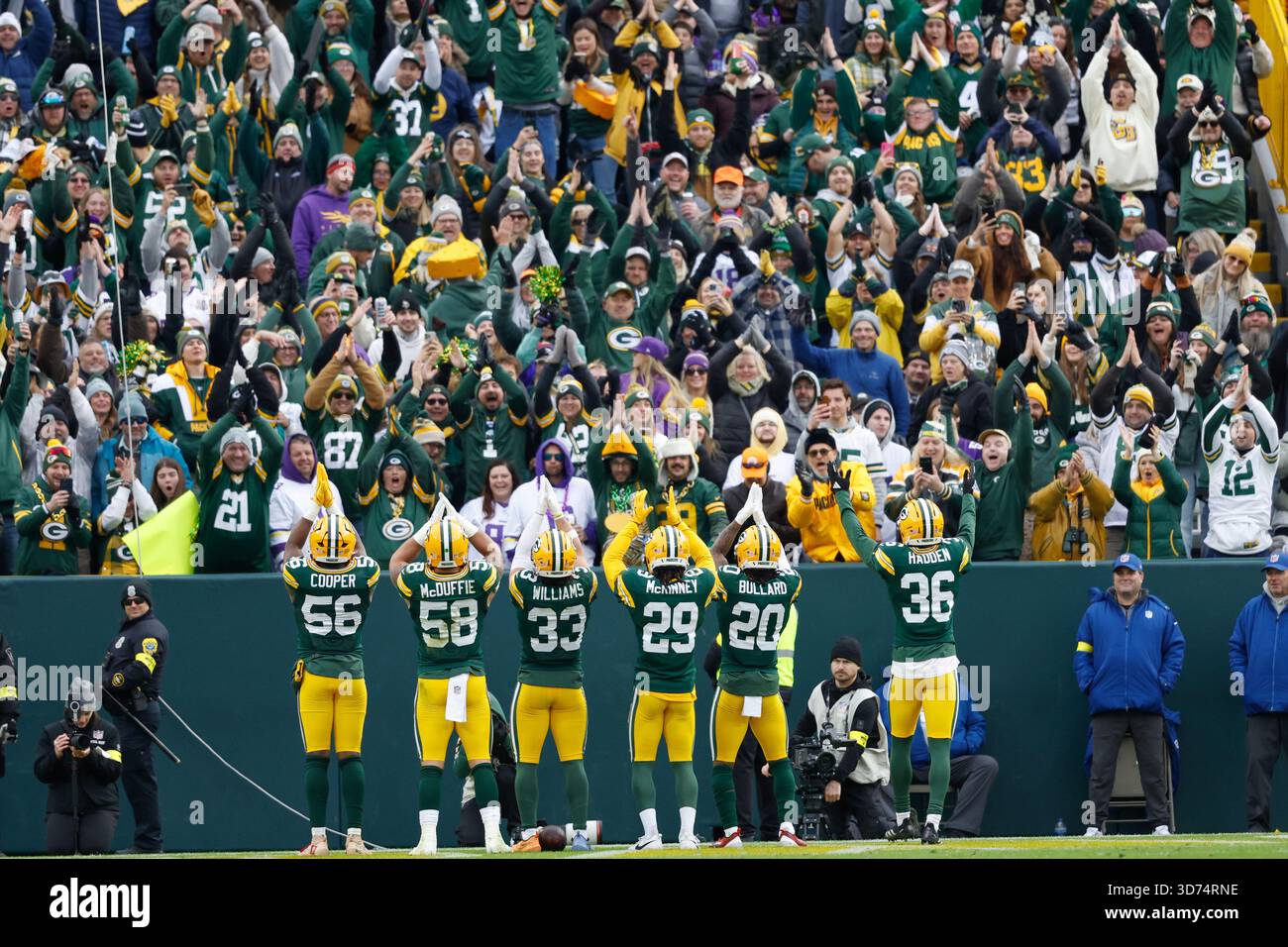 The Green Bay Packers defense celebrates an interception with fans ...