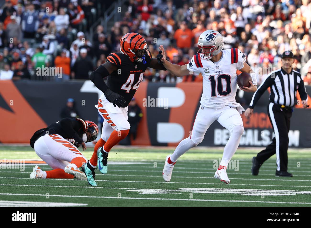 New England Patriots quarterback Drake Maye (10) tries to stiff arm ...