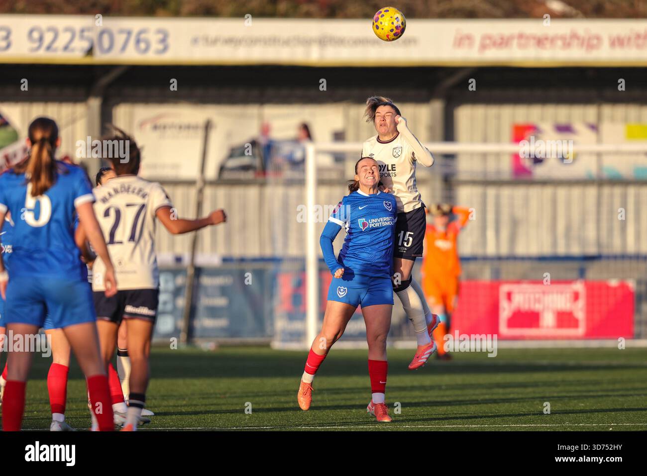 Anna Csiki (15 West Ham) heads away from Ava Rowbotham (8 Portsmouth FC ...