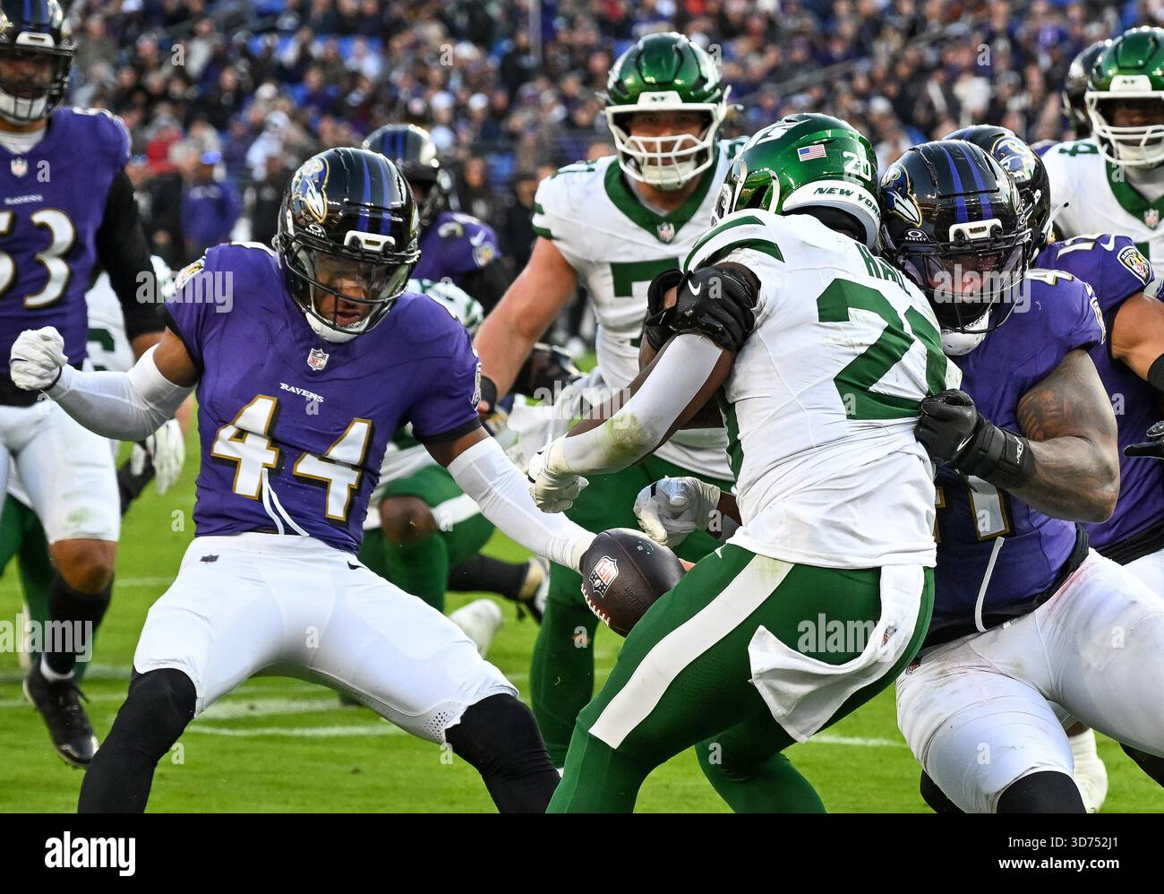 New York Jets running back Breece Hall (20) fumbles under pressure from ...