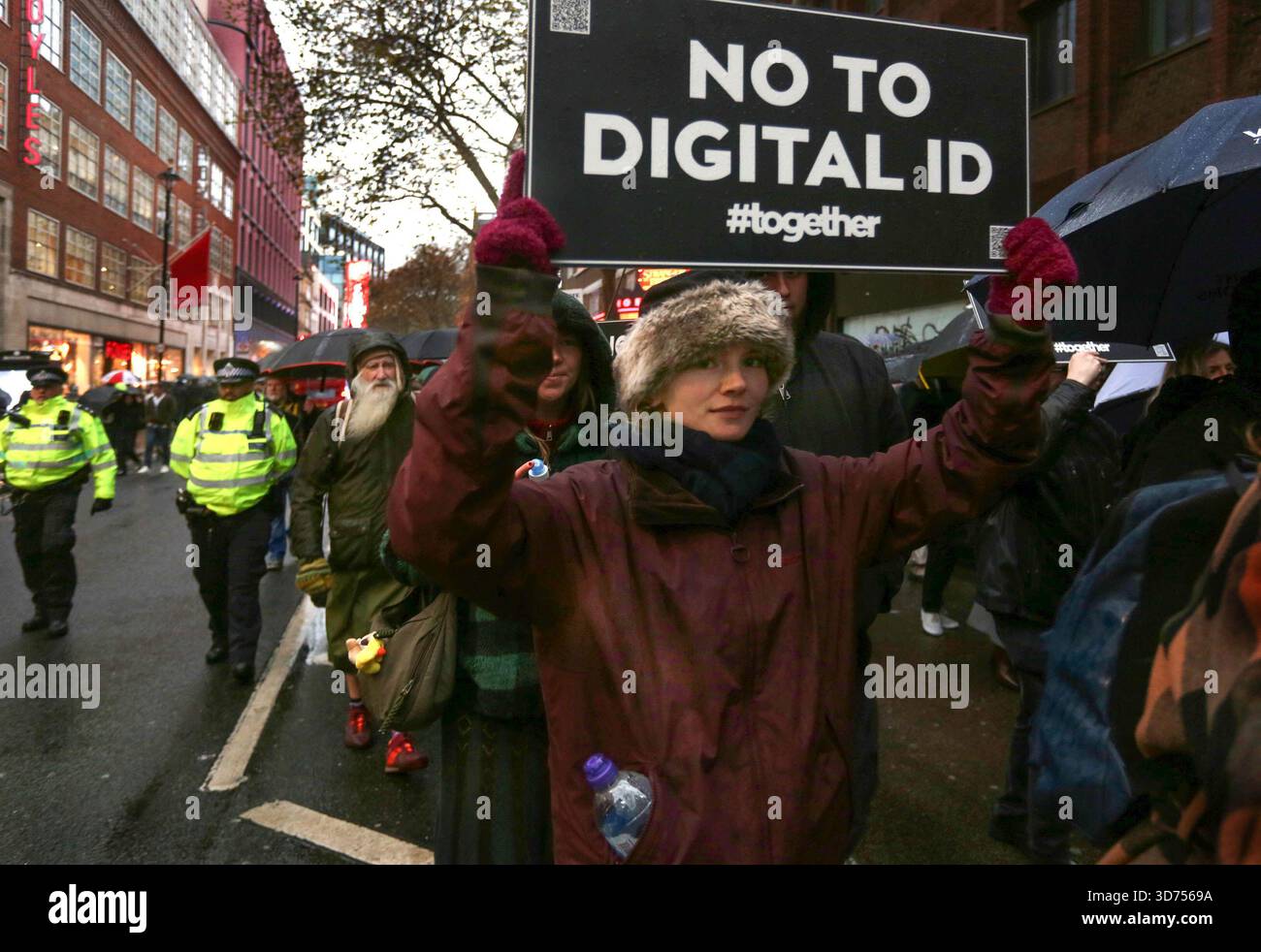 Demonstrator carrying placard protesting hi-res stock photography and ...