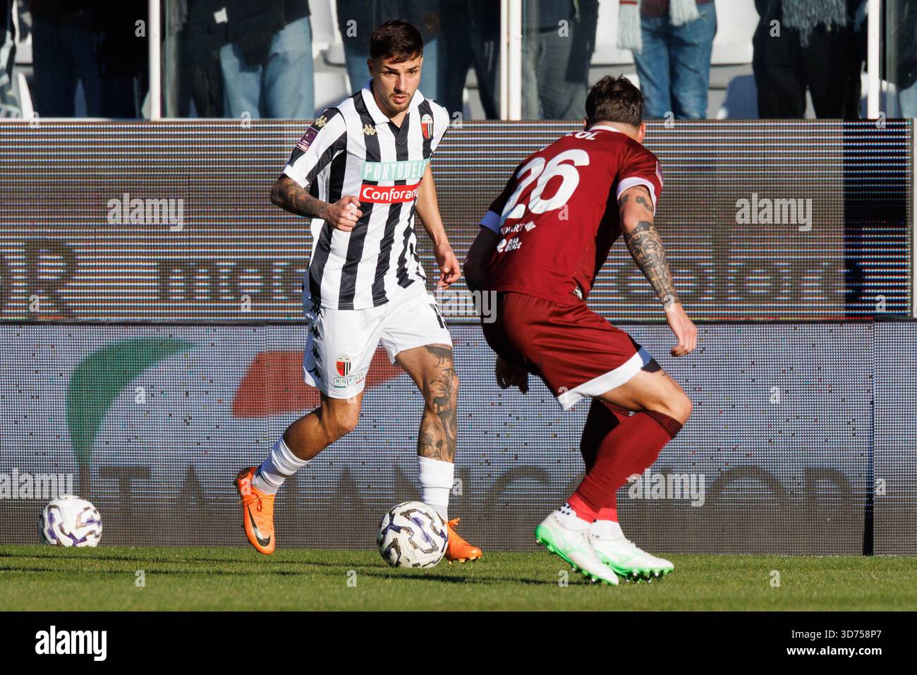 Simone D'Uffizi of Ascoli and Filippo De Col compete for the ball ...