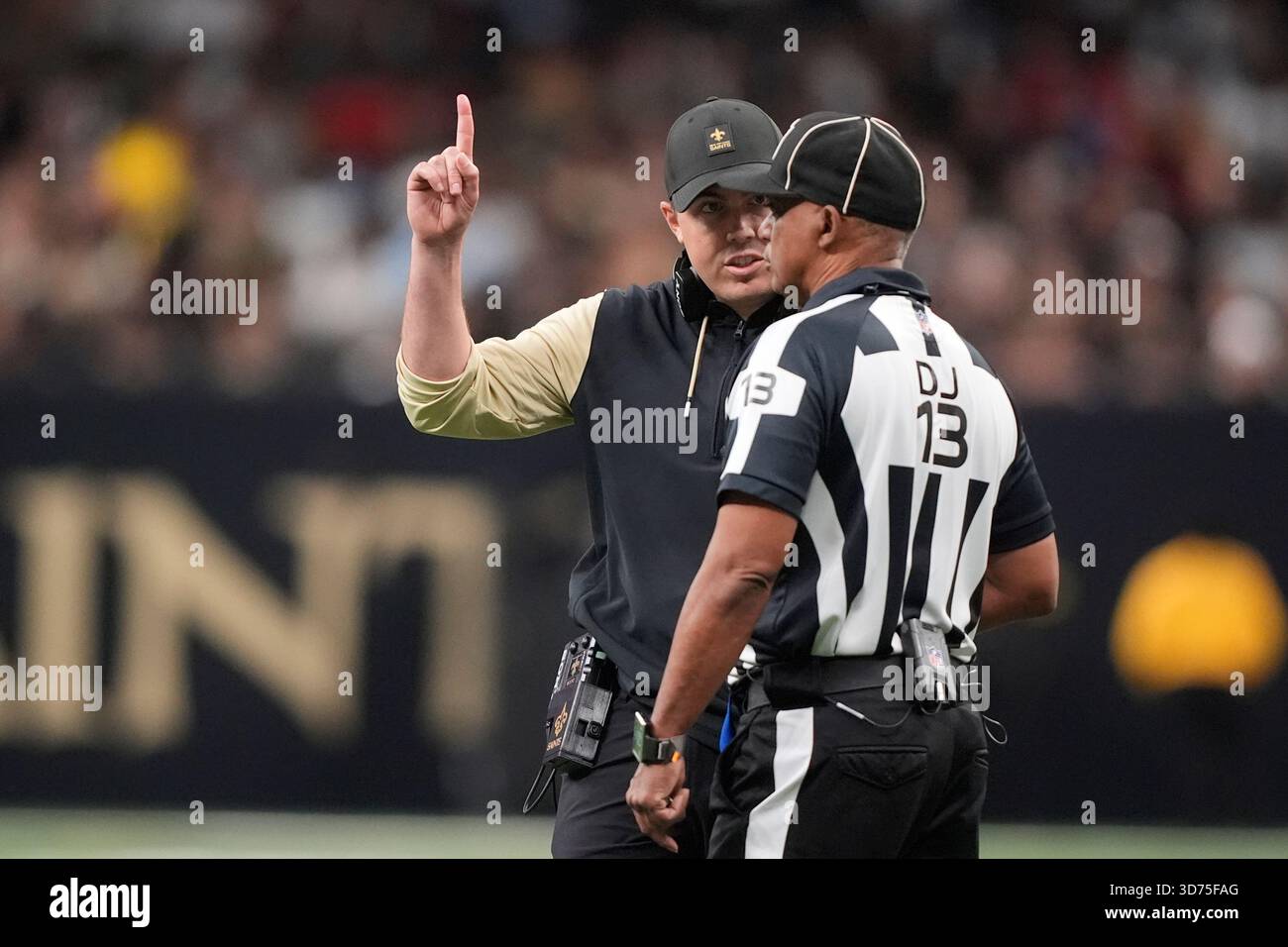 New Orleans Saints head coach Kellen Moore talks with down judge ...