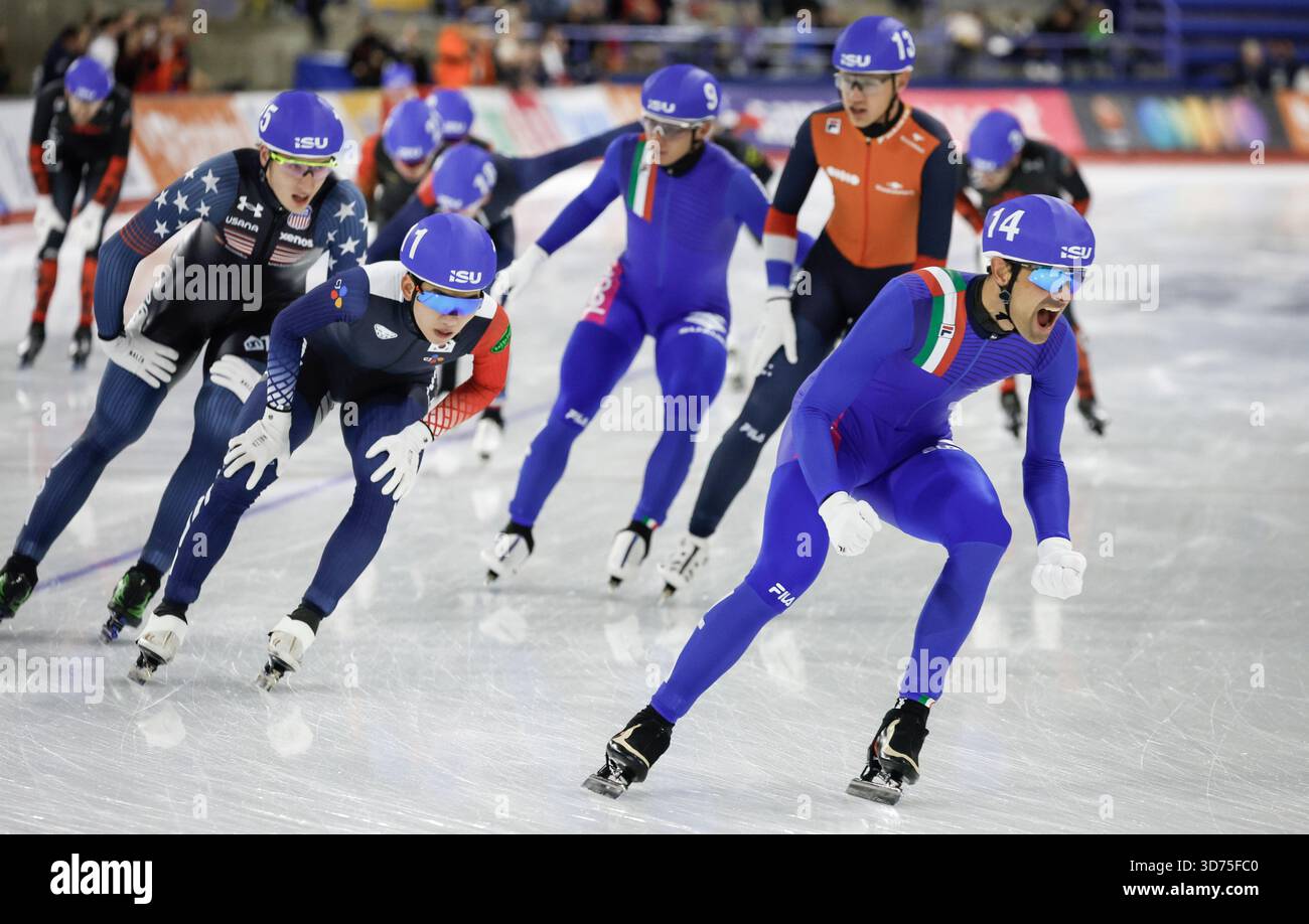 Italy's Andrea Giovannini, right, celebrates winning the men's mass ...