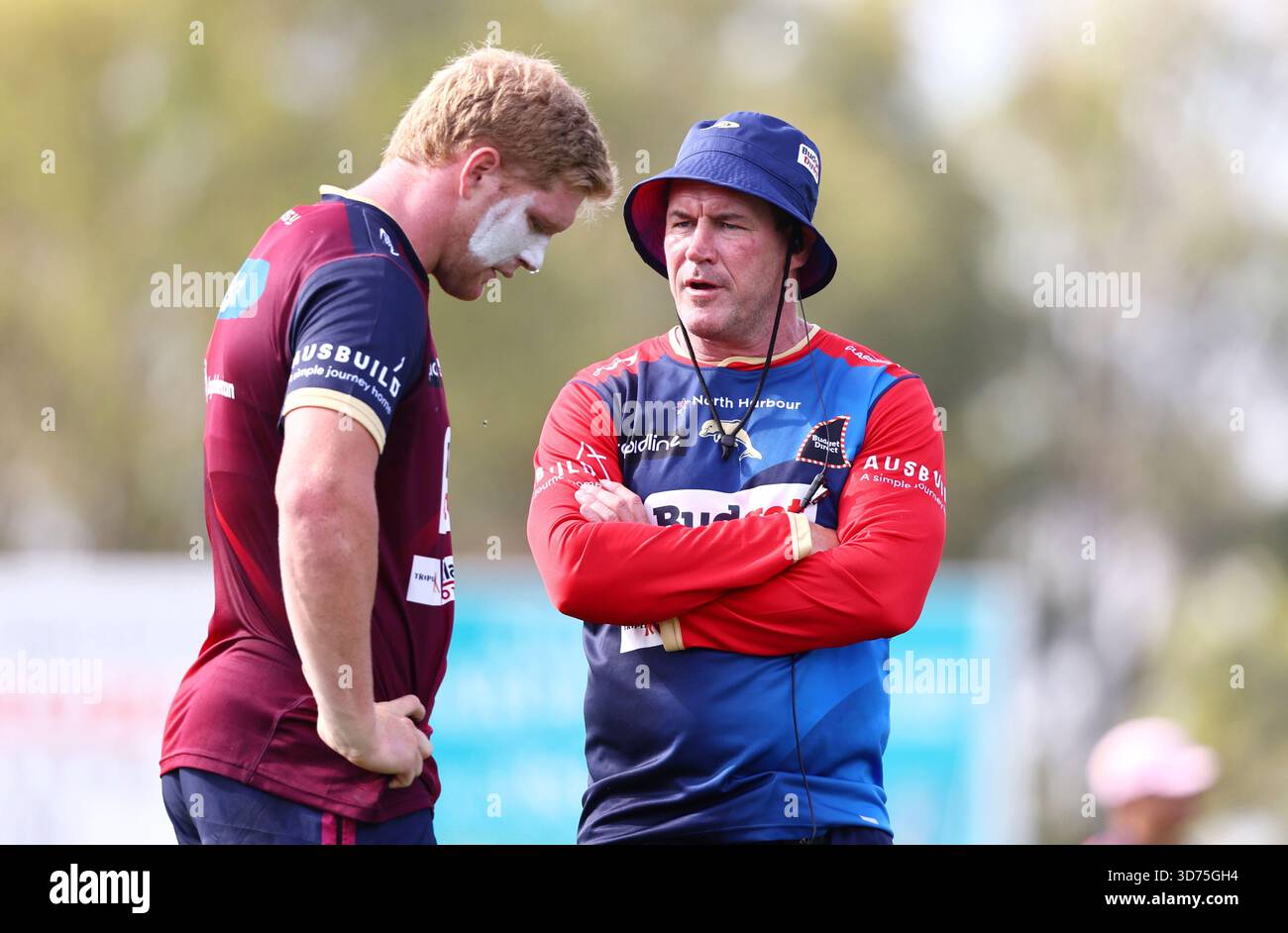Thomas Flegler (Left) talks with coach Kristian Woolf during a Dolphins ...