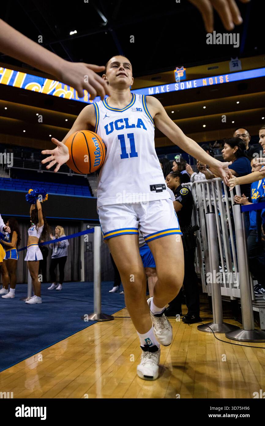 UCLA forward Gabriela Jaquez (11) runs onto the court before an NCAA ...