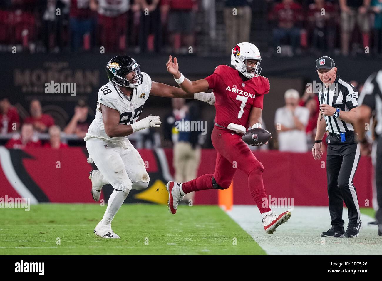 Arizona Cardinals quarterback Jacoby Brissett (7) is forced out of ...