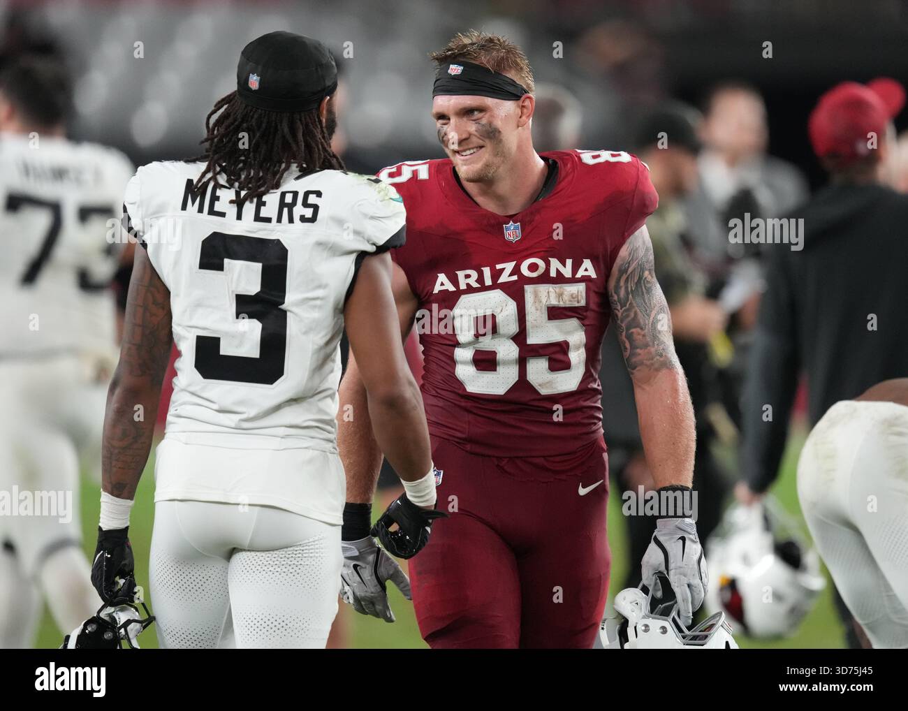 Arizona Cardinals tight end Trey McBride (85) greets Jacksonville ...