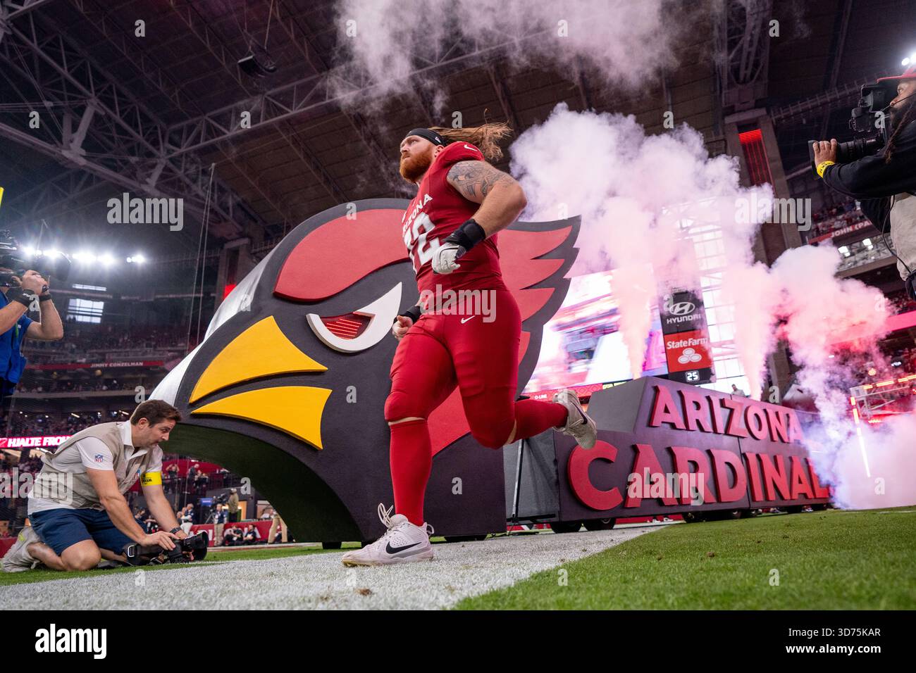Arizona Cardinals guard Hjalte Froholdt (72) runs out on the field ...