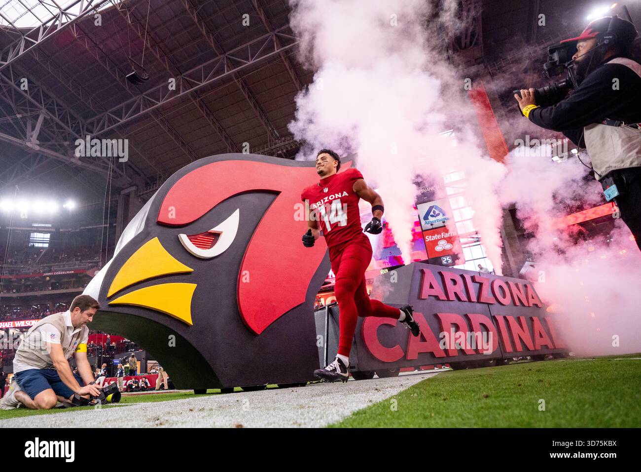 Arizona Cardinals wide receiver Michael Wilson (14) runs out on the ...