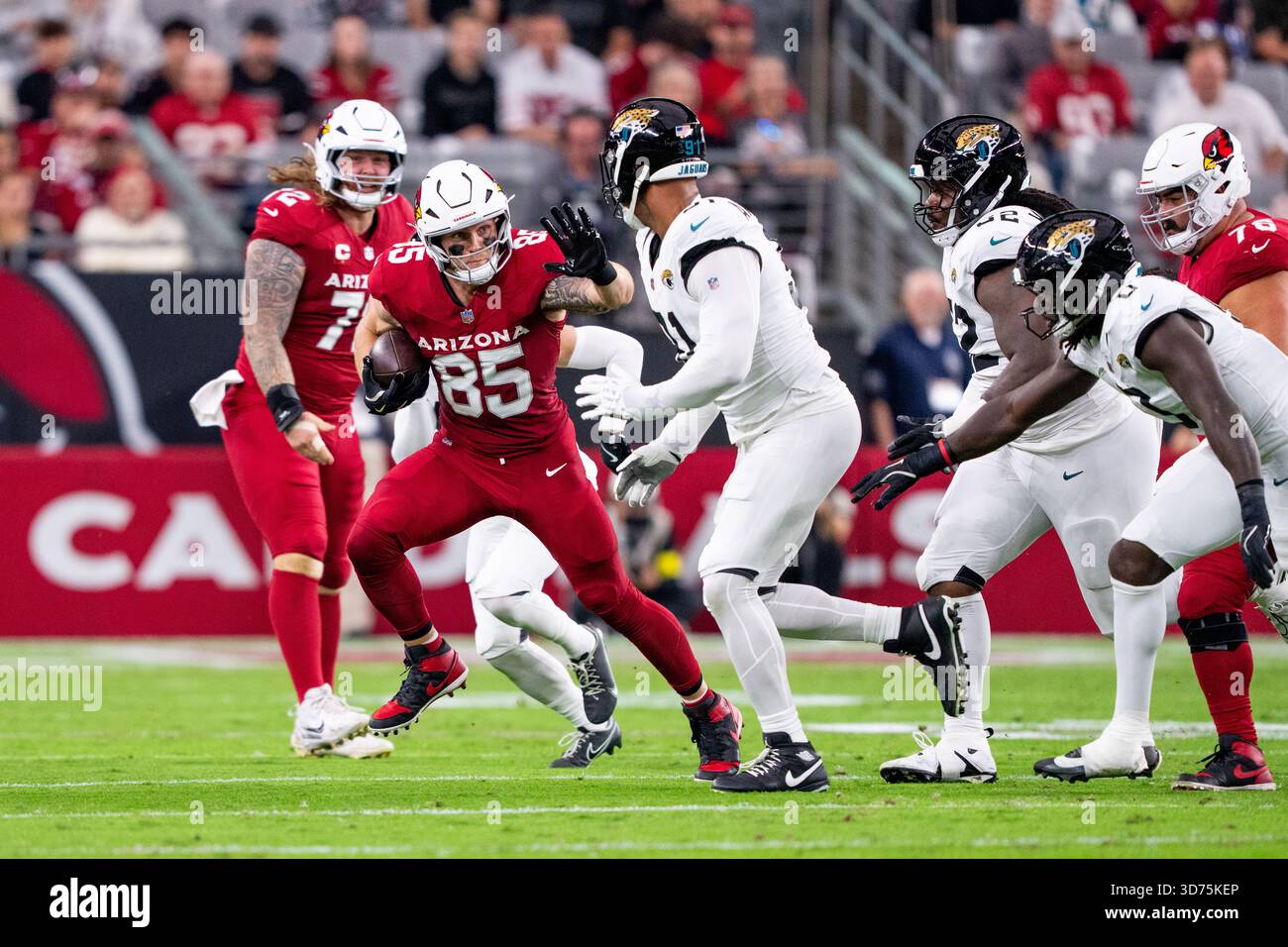 Arizona Cardinals tight end Trey McBride (85) pushes off Jacksonville ...