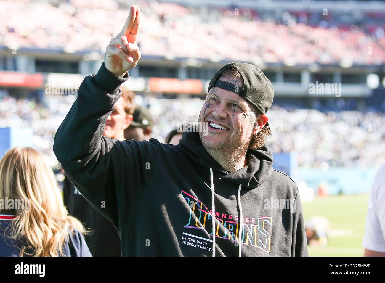 Jelly Roll waves to fans before the game between the Tennessee Titans ...