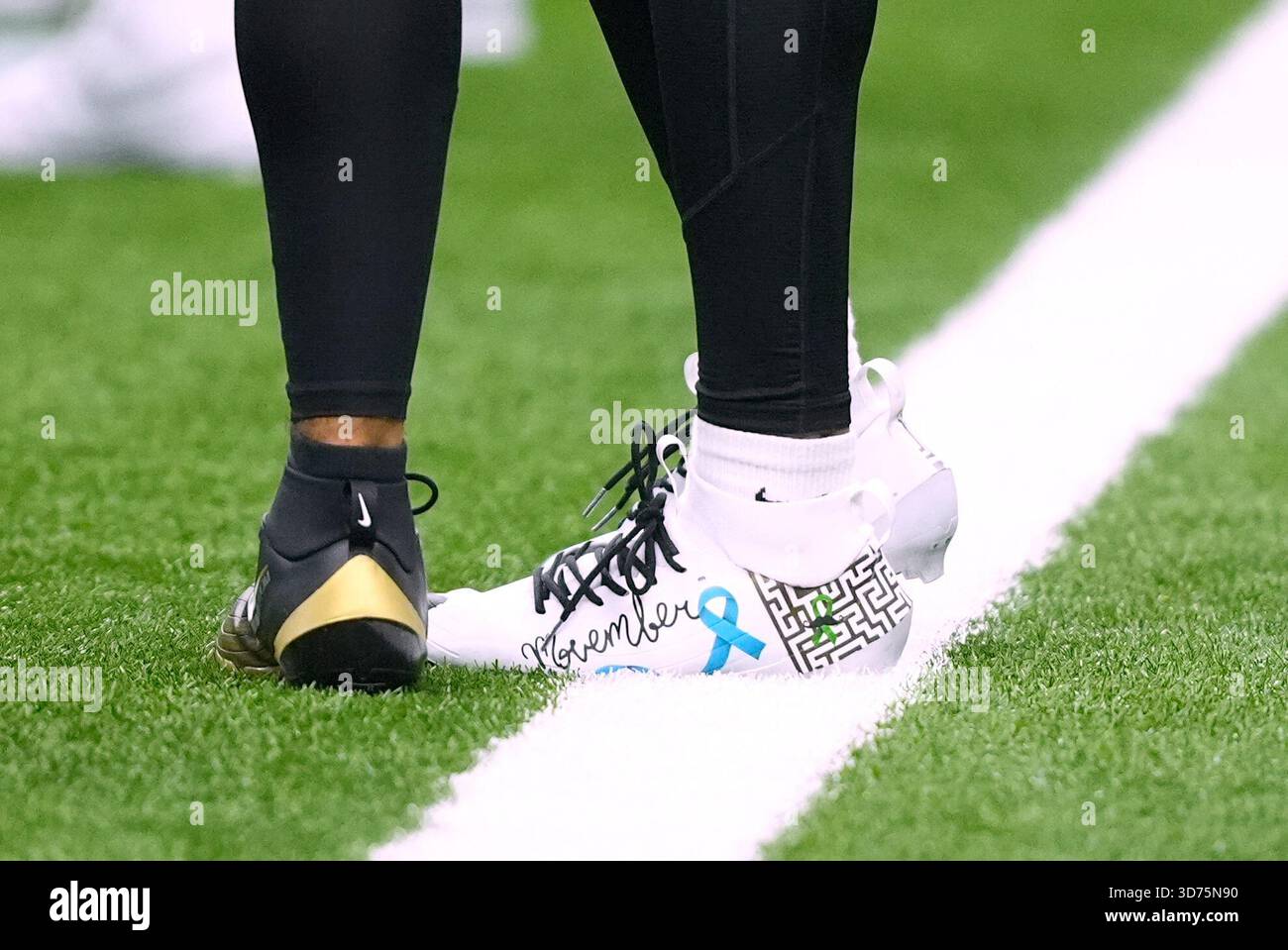 New Orleans Saints running back Devin Neal (24) wears cleats for the My ...