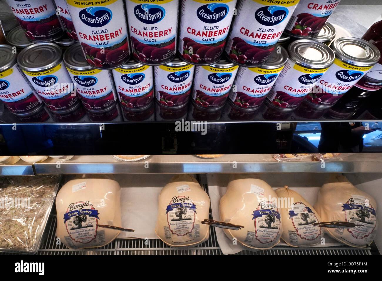 FILE - Cans of cranberry sauce line a turkey display case at Bongi's ...