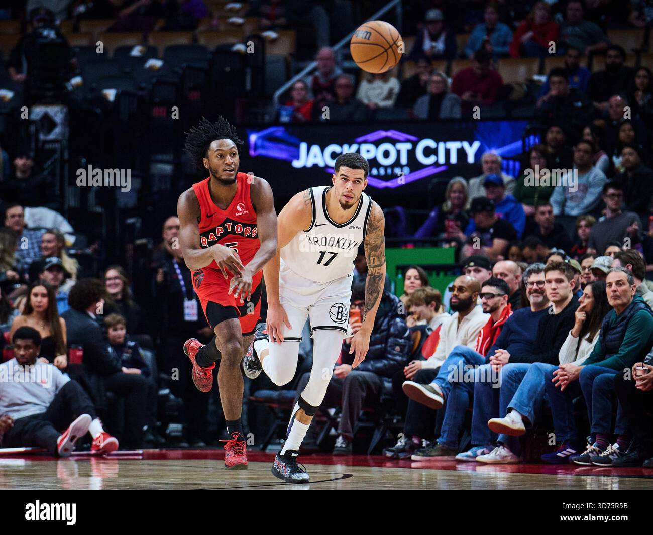 Toronto Raptors' Immanuel Quickley makes a pass as Brooklyn Nets ...