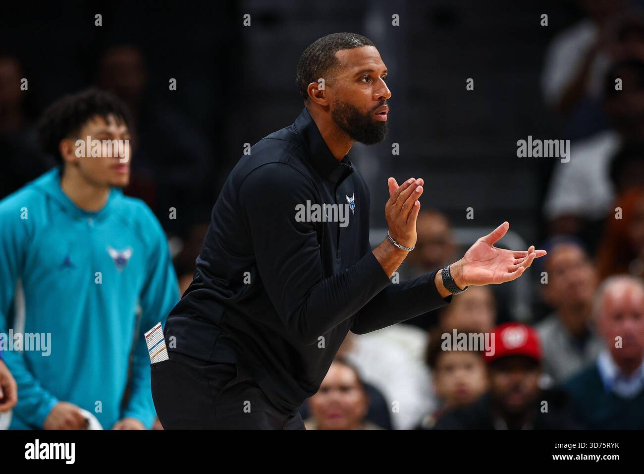 Charlotte Hornets head coach Charles Lee reacts during the first half ...