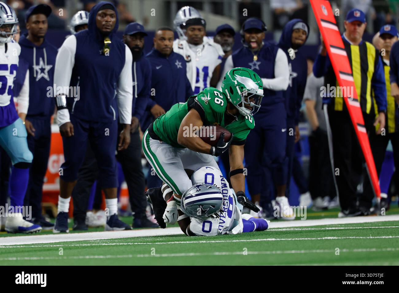 Dallas Cowboys linebacker DeMarvion Overshown (0) makes the tackle on ...