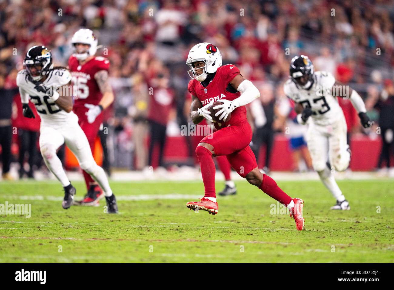 Arizona Cardinals wide receiver Greg Dortch (4) runs with the ball for ...